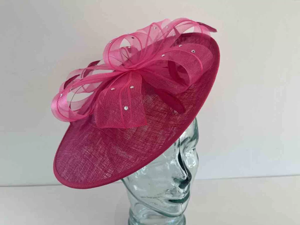 Circular sinamay hatinator with crin loops in hot pink - Love Fascinators